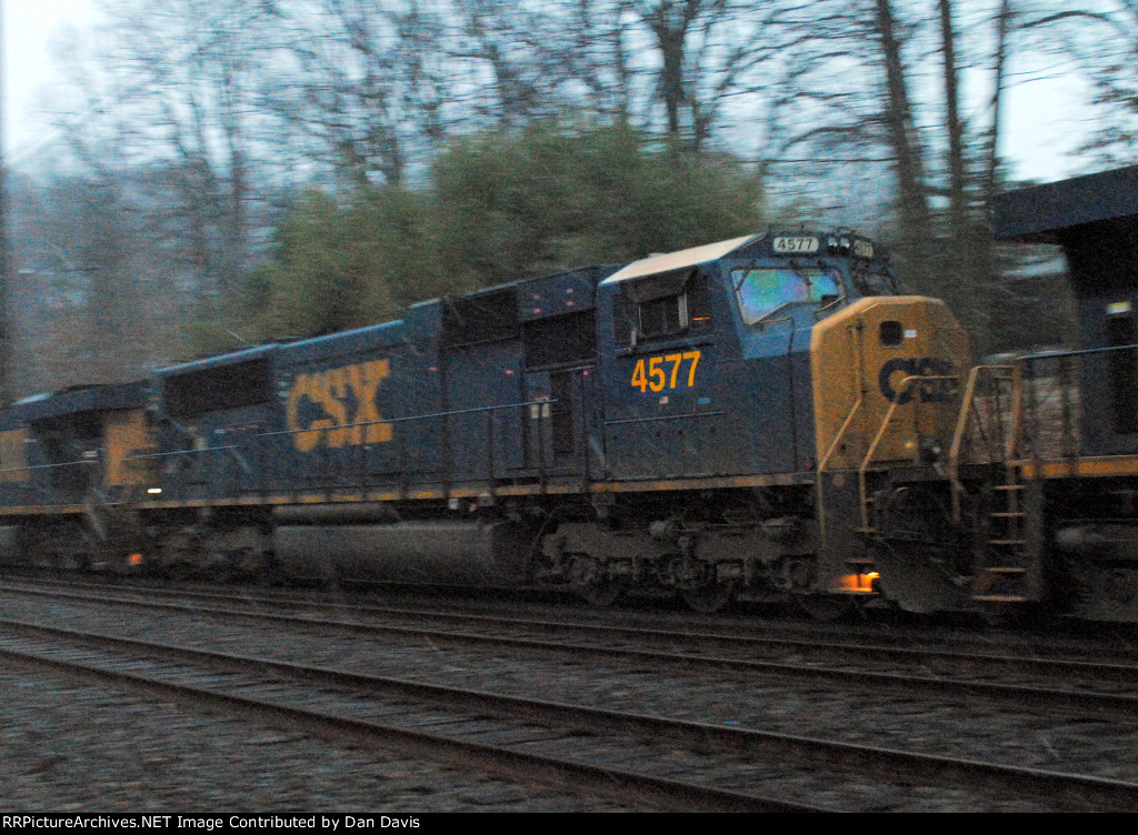 Pan of CSX SD70AC 4577 trailing on Q034-10